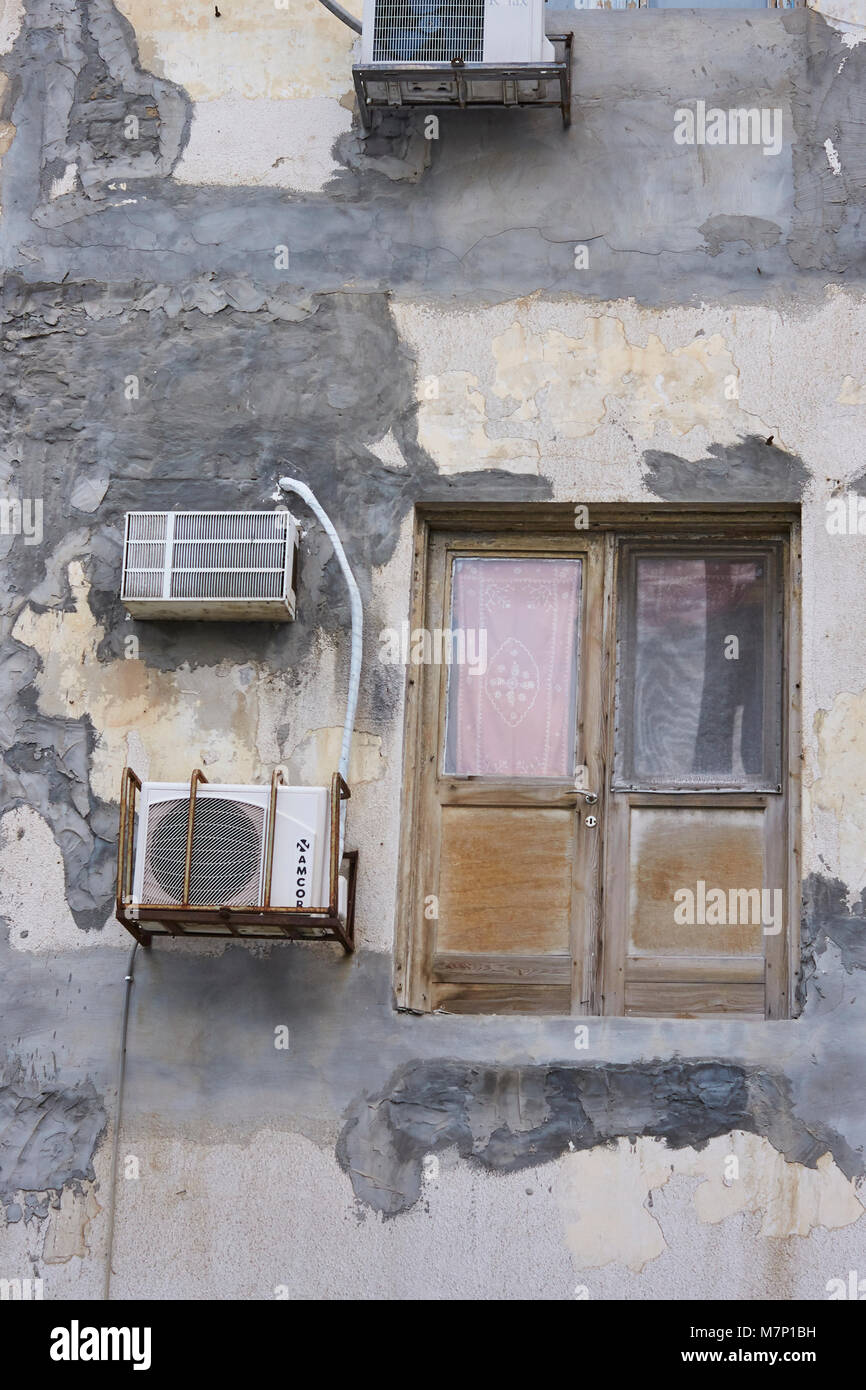 doors in the side of a building where the balcony is missing making a ...
