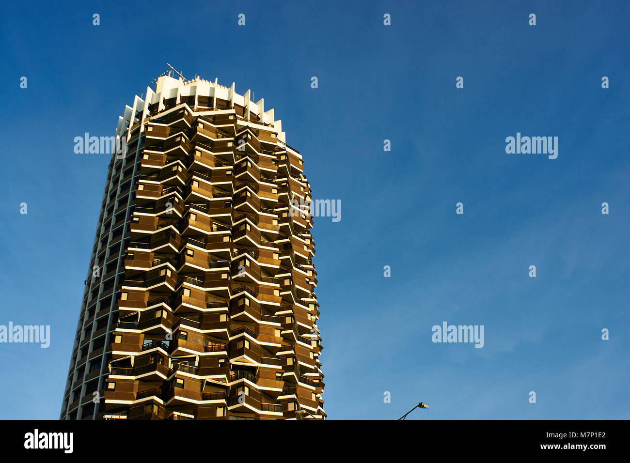 a modernist apartment building against a blue sky in tel aviv israel ...