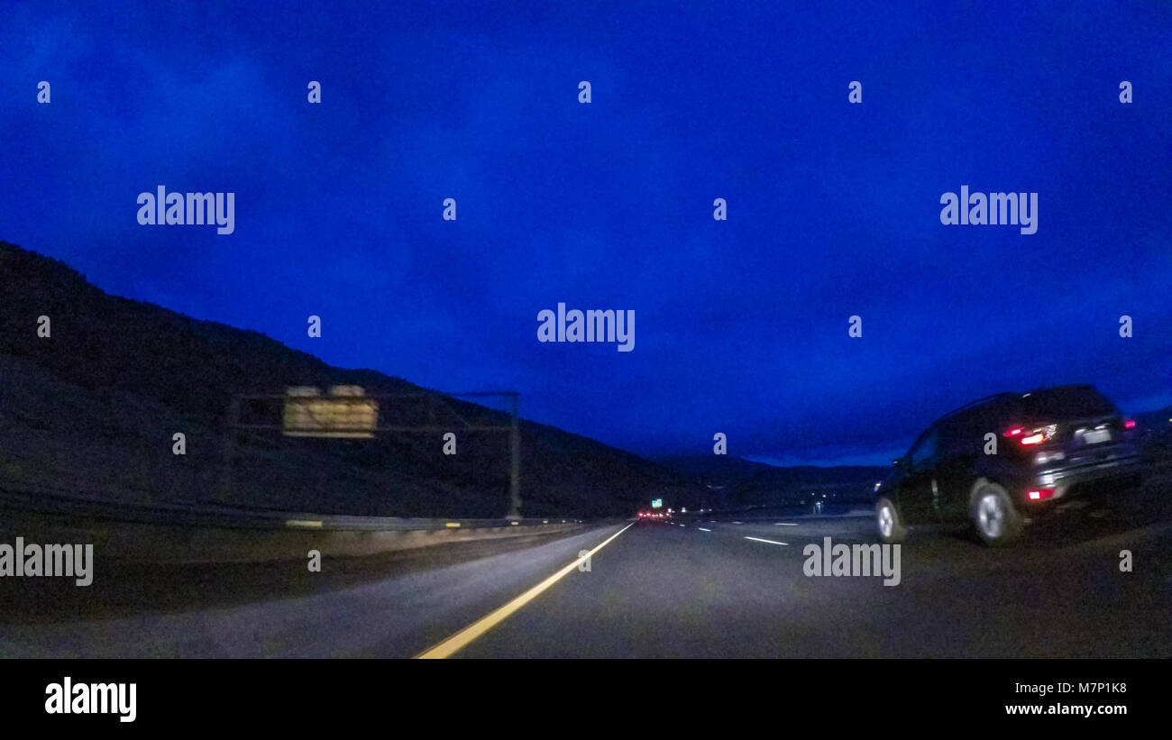 Driving on Interstate highway I25 at night Stock Photo - Alamy
