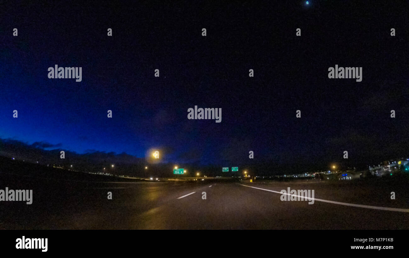Driving on Interstate highway I25 at night Stock Photo - Alamy