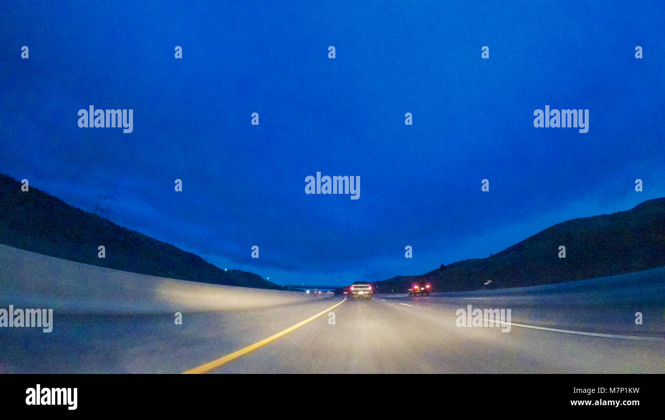 Driving on Interstate highway I25 at night Stock Photo - Alamy