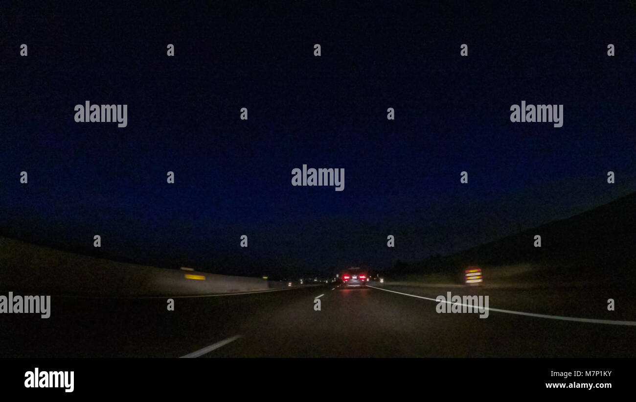 Driving on Interstate highway I25 at night Stock Photo - Alamy