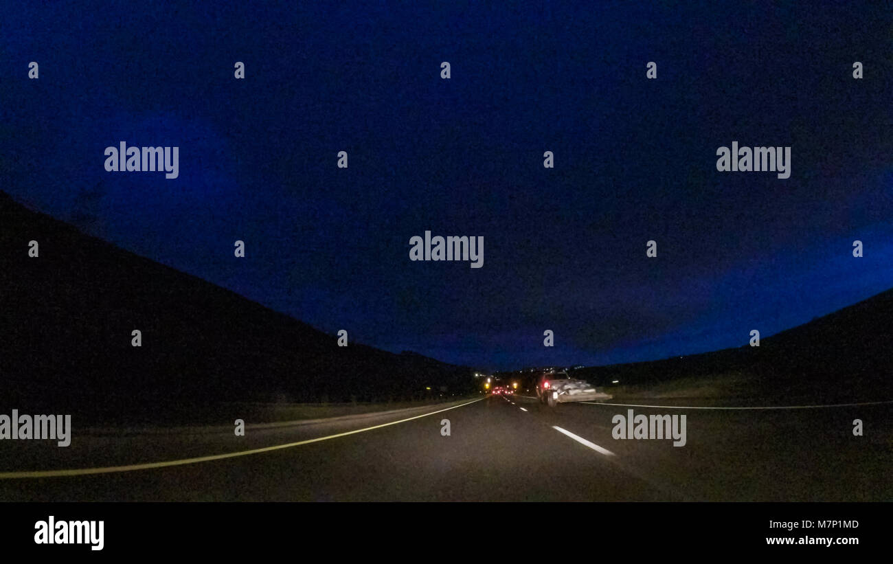 Driving on Interstate highway I25 at night Stock Photo - Alamy