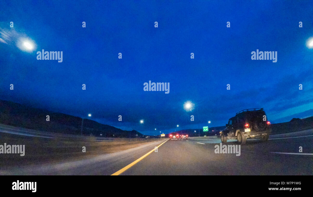 Driving on Interstate highway I25 at night Stock Photo - Alamy