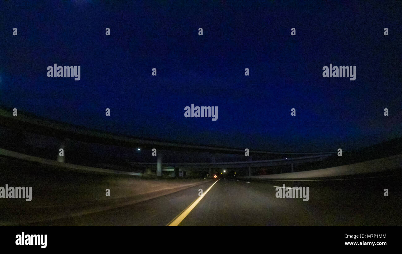 Driving on Interstate highway I25 at night Stock Photo - Alamy