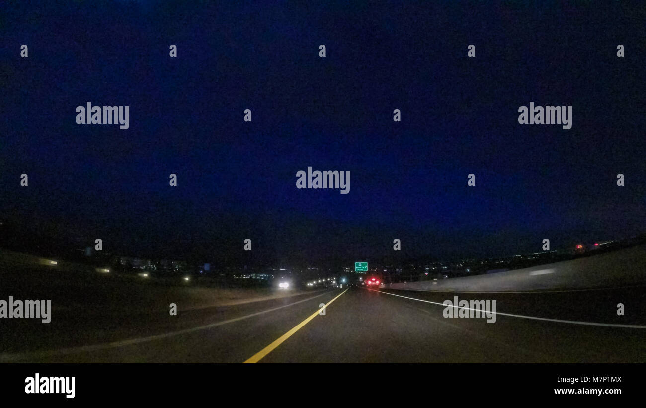 Driving on Interstate highway I25 at night Stock Photo - Alamy