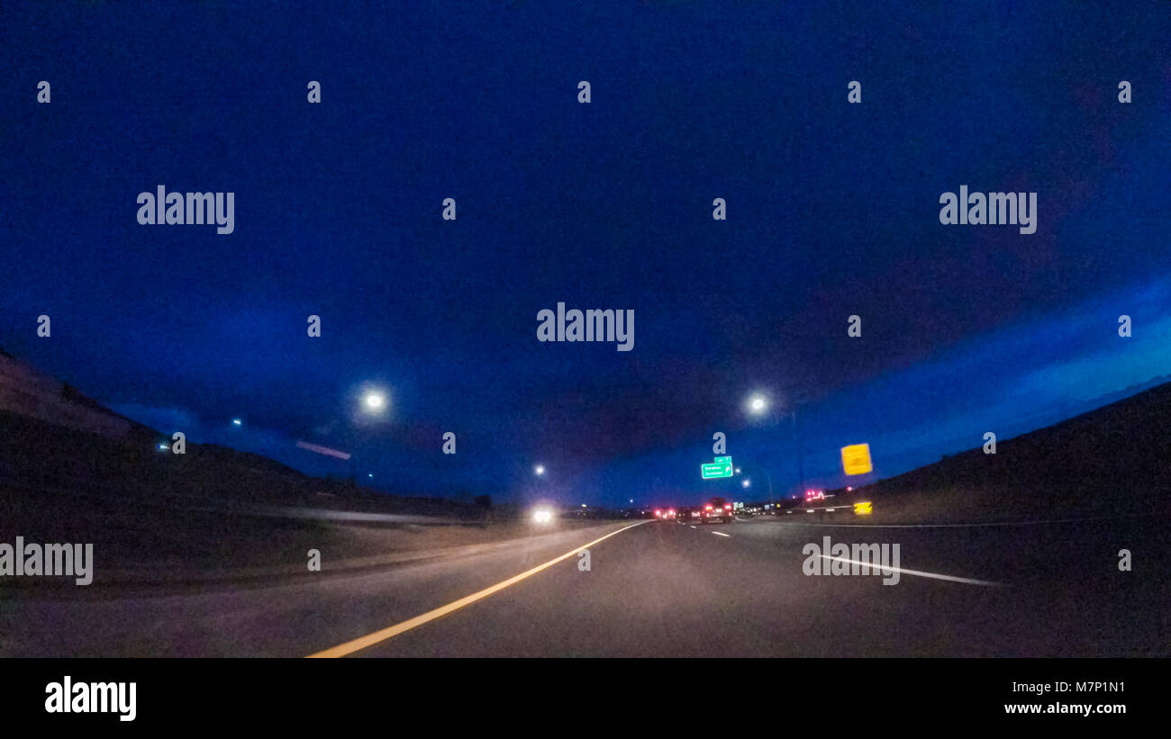 Driving on Interstate highway I25 at night Stock Photo - Alamy