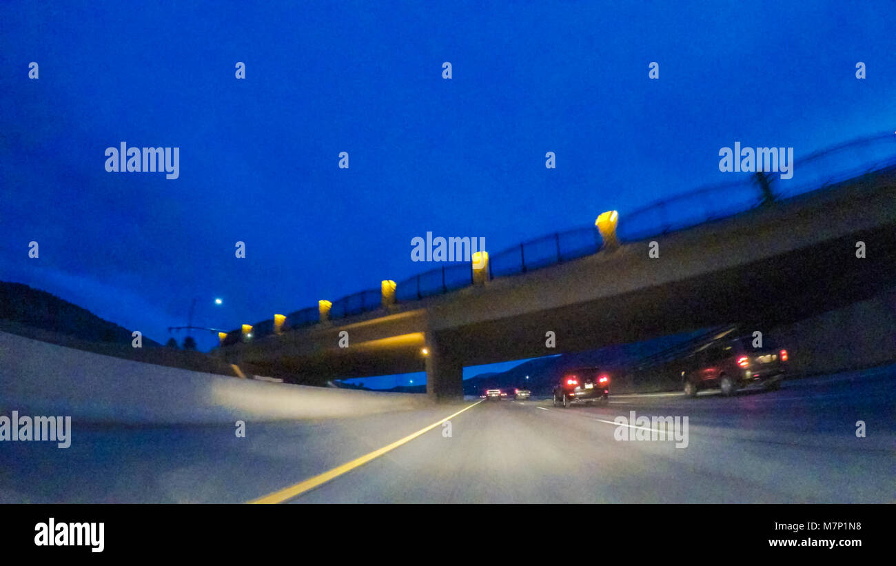 Driving on Interstate highway I25 at night Stock Photo - Alamy
