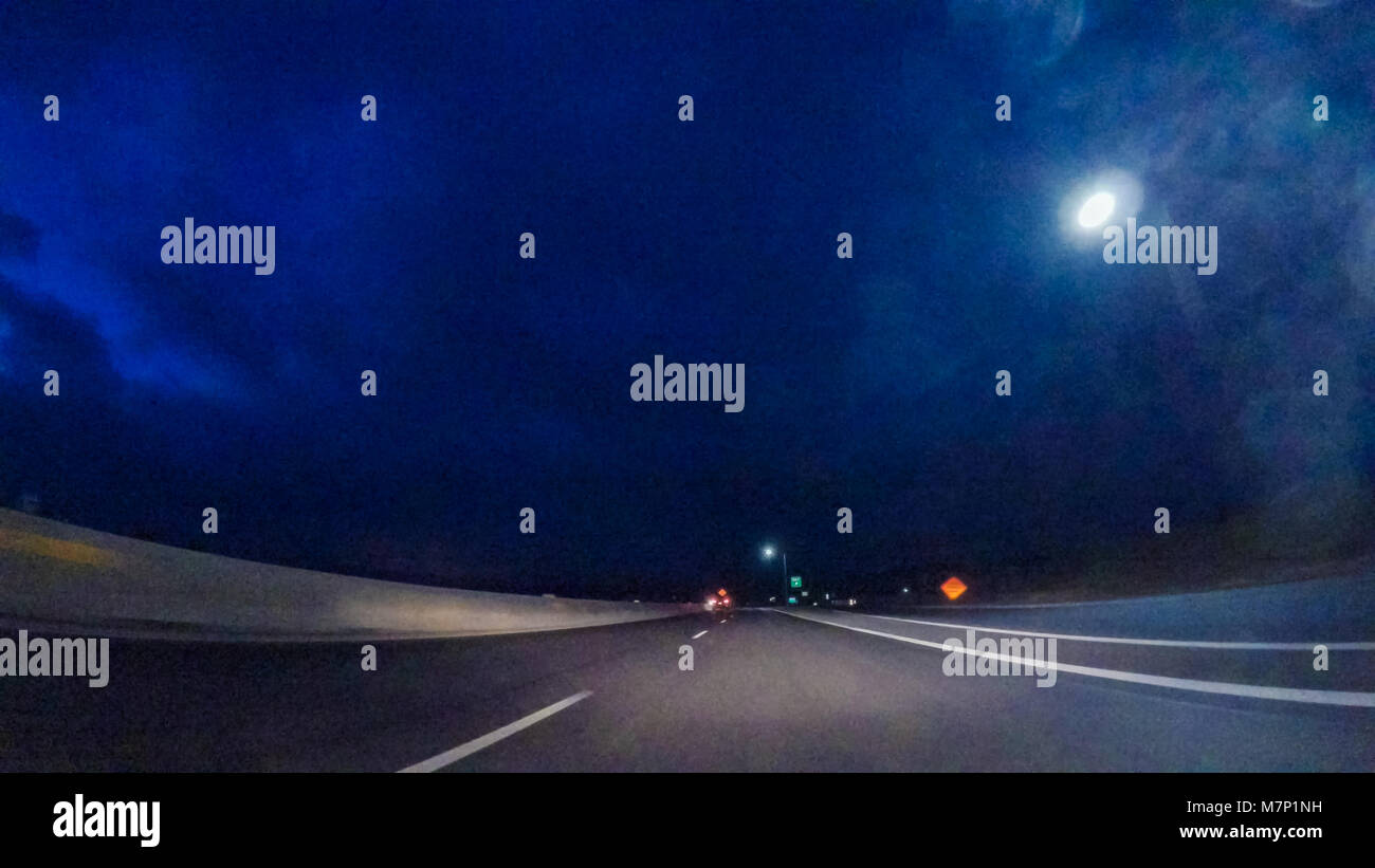 Driving on Interstate highway I25 at night Stock Photo - Alamy