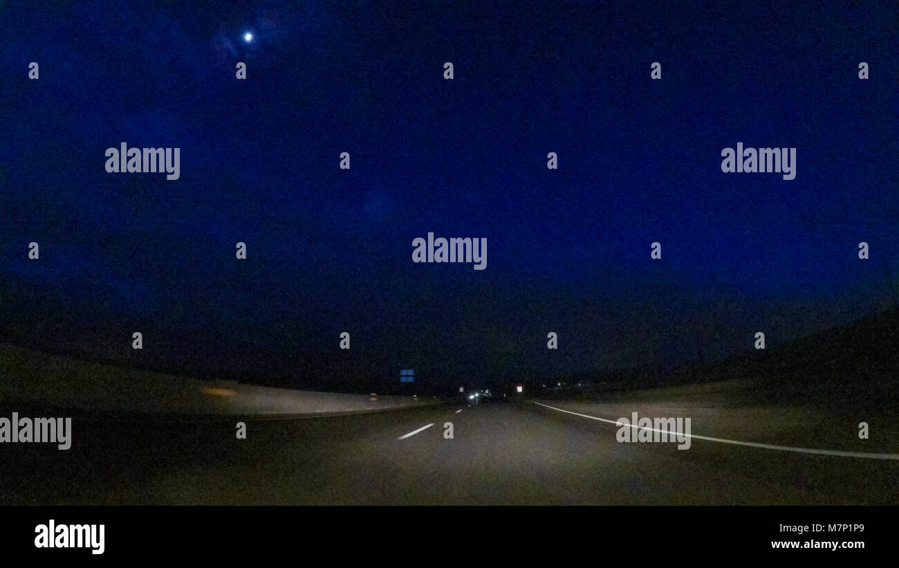 Driving on Interstate highway I25 at night Stock Photo - Alamy