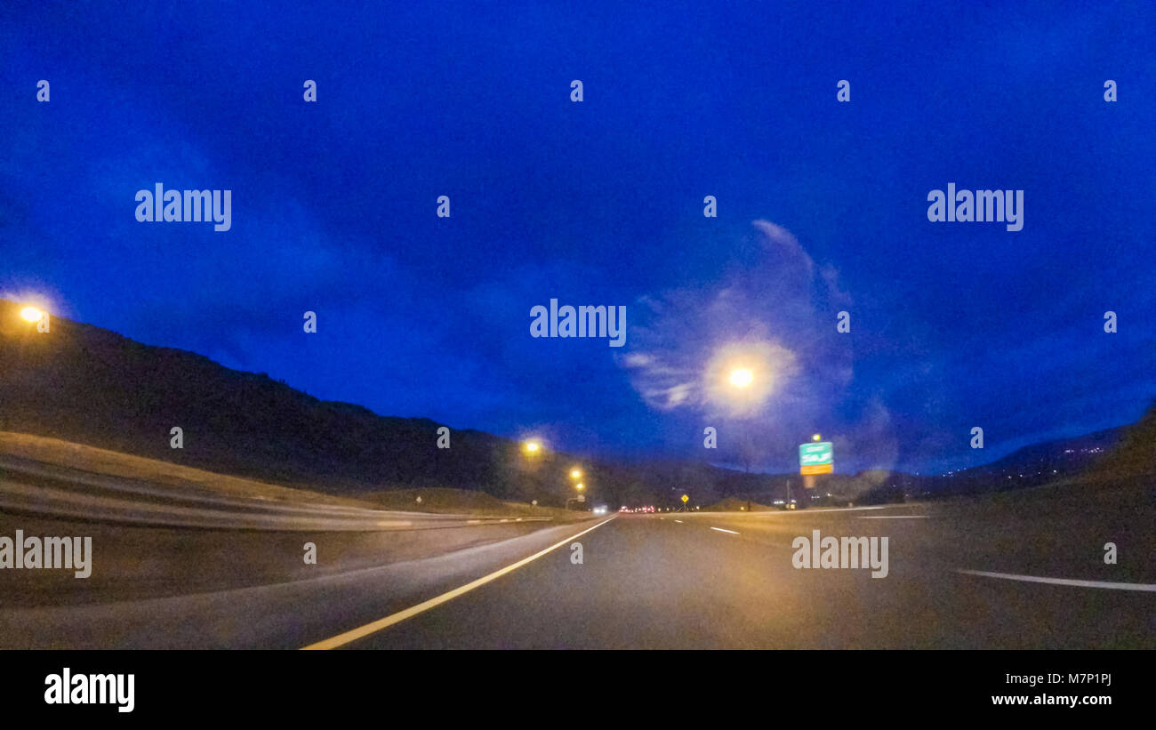 Driving on Interstate highway I25 at night Stock Photo - Alamy