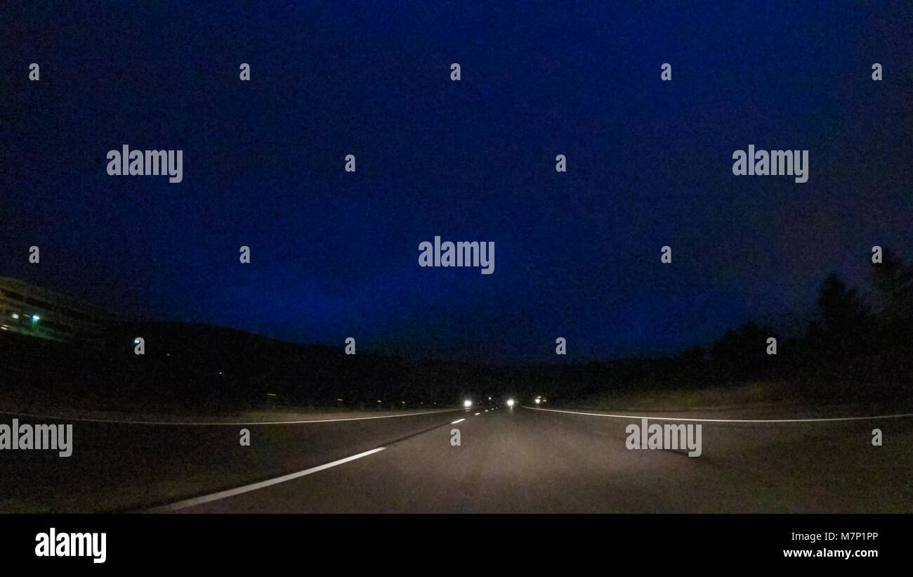 Driving on Interstate highway I25 at night Stock Photo - Alamy