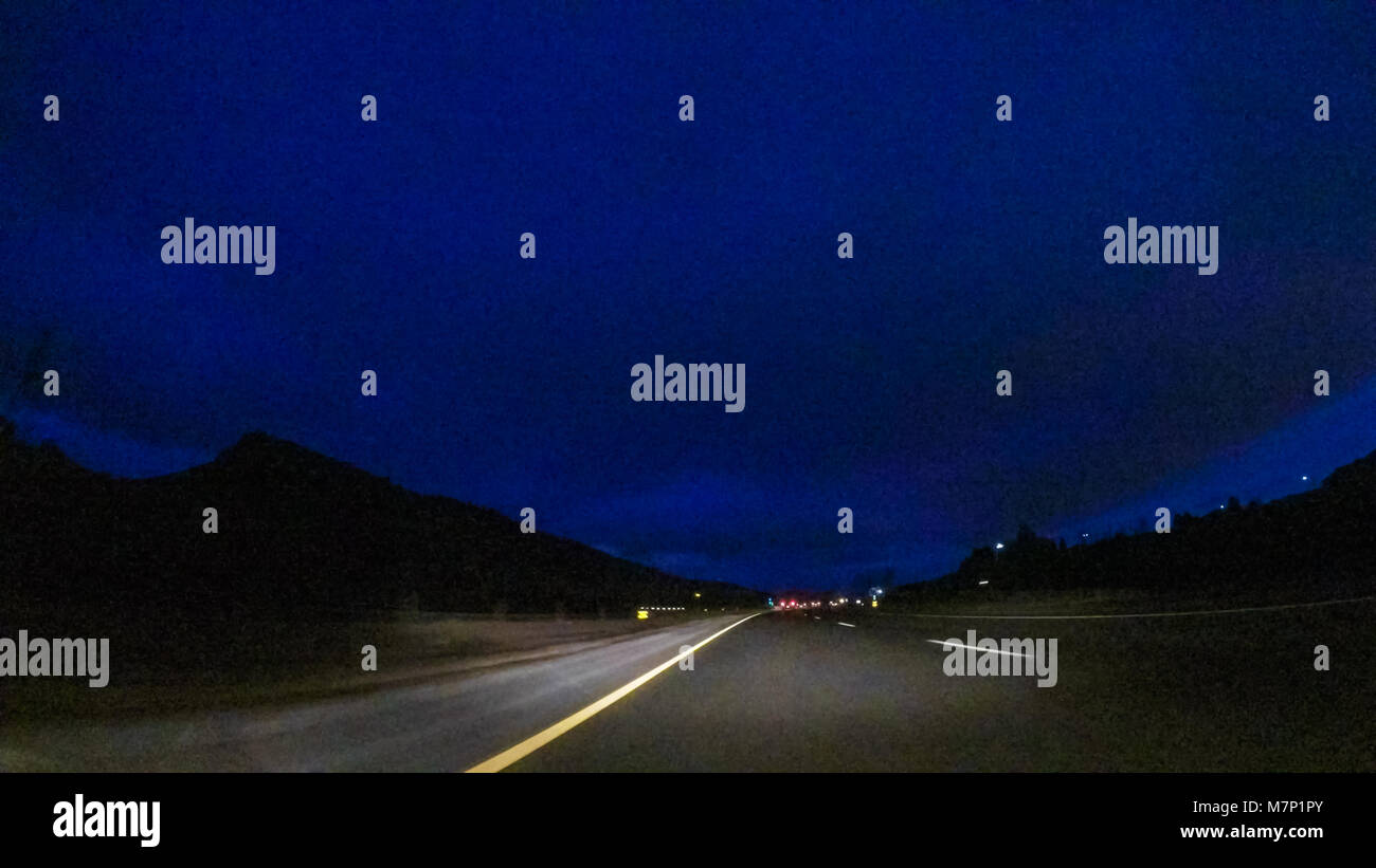 Driving on Interstate highway I25 at night Stock Photo - Alamy