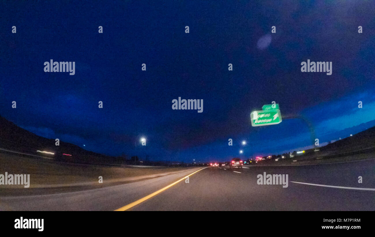 Driving on Interstate highway I25 at night Stock Photo - Alamy