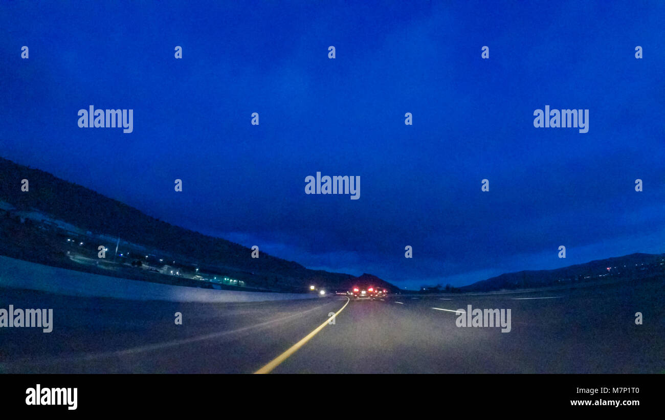 Driving on Interstate highway I25 at night Stock Photo - Alamy