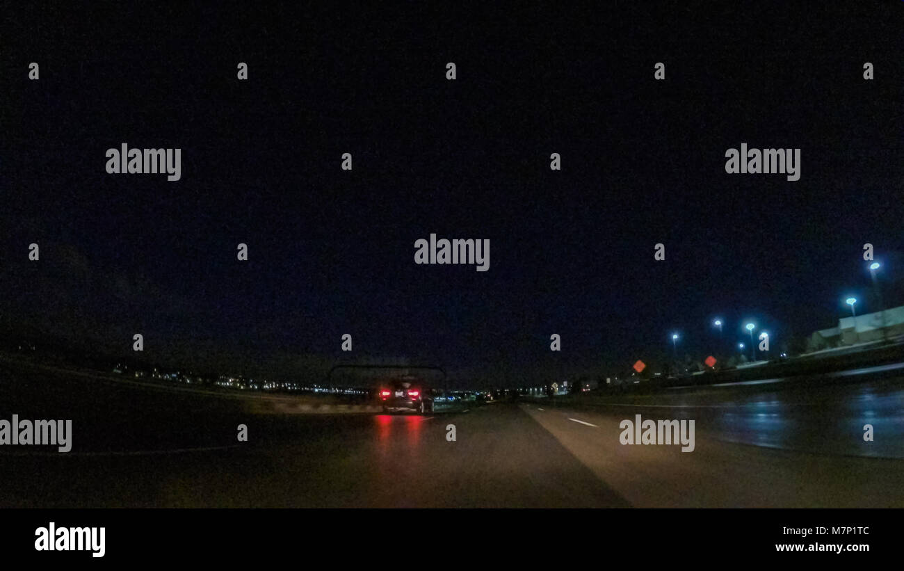 Driving on Interstate highway I25 at night Stock Photo - Alamy