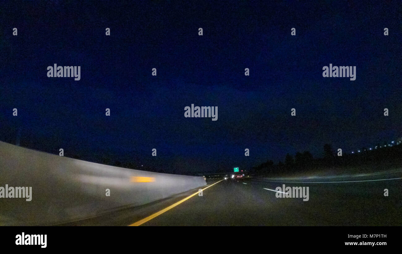 Driving on Interstate highway I25 at night Stock Photo - Alamy