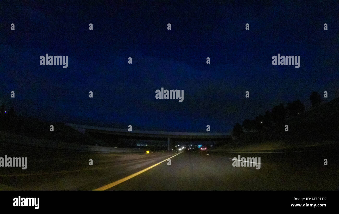 Driving on Interstate highway I25 at night Stock Photo - Alamy