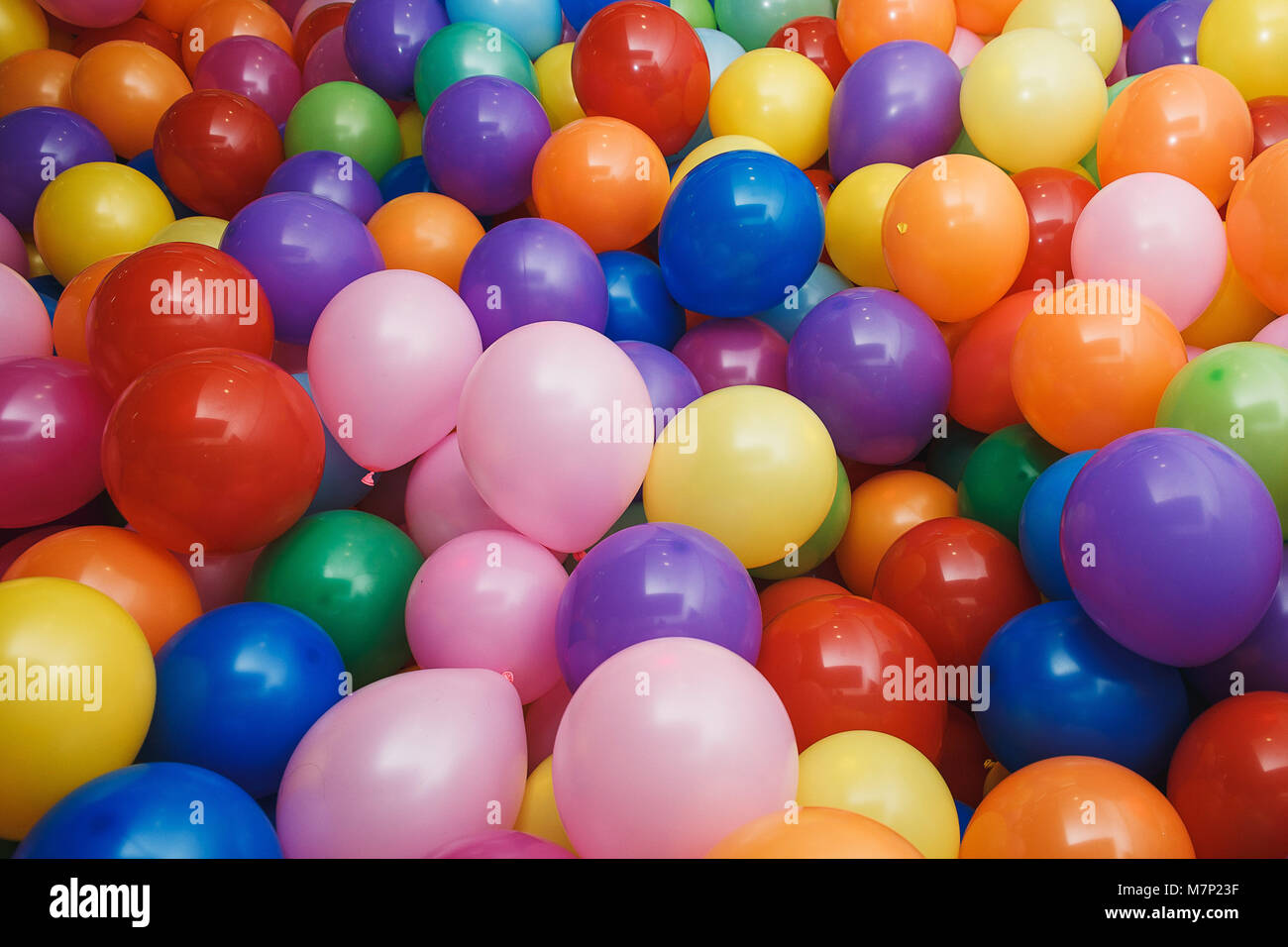Multicolored balloons. Red, pink, blue, yellow and orange balloons. The ...