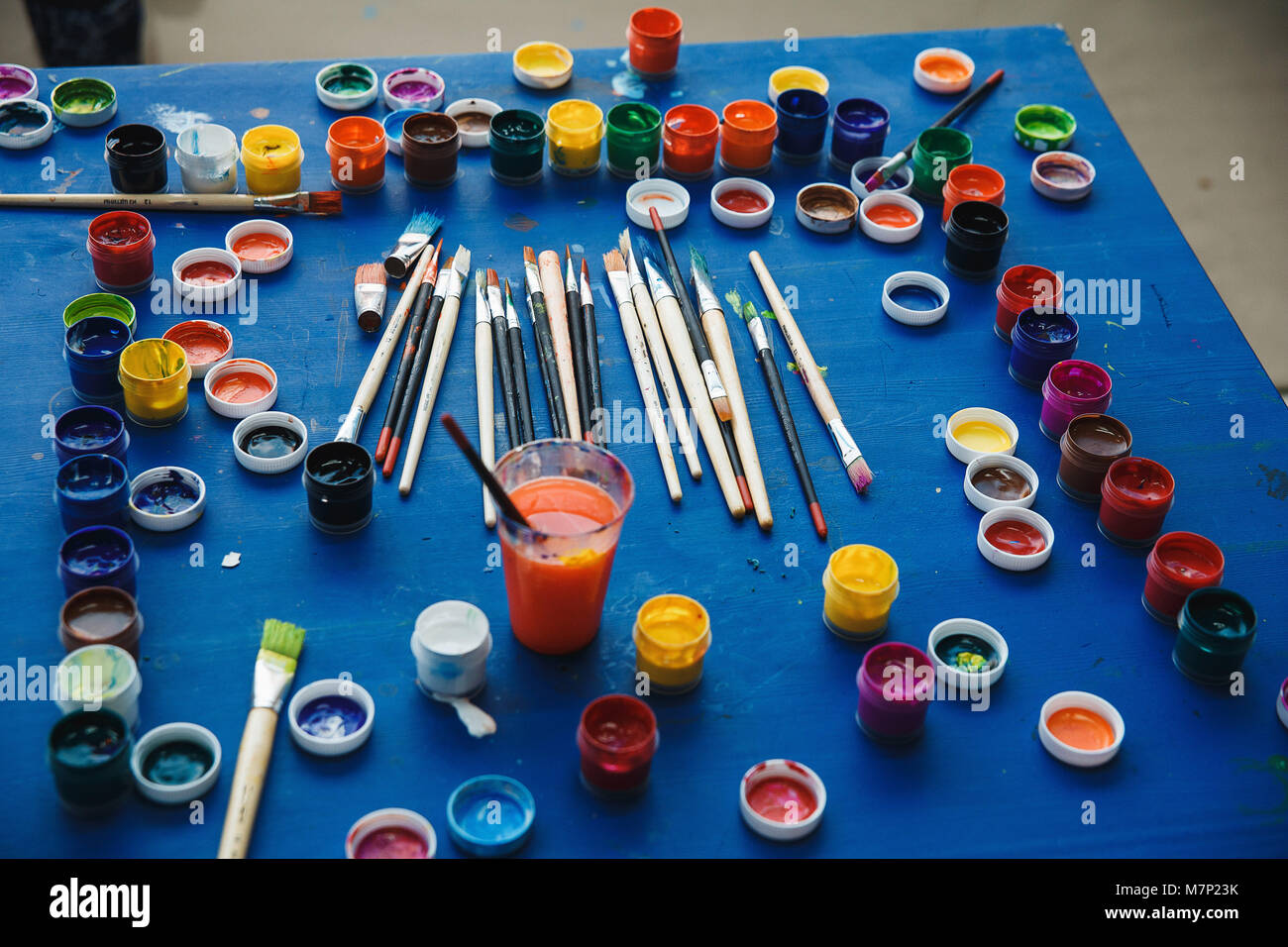 creative mess on the artist's desk at a children's party, soft focus ...