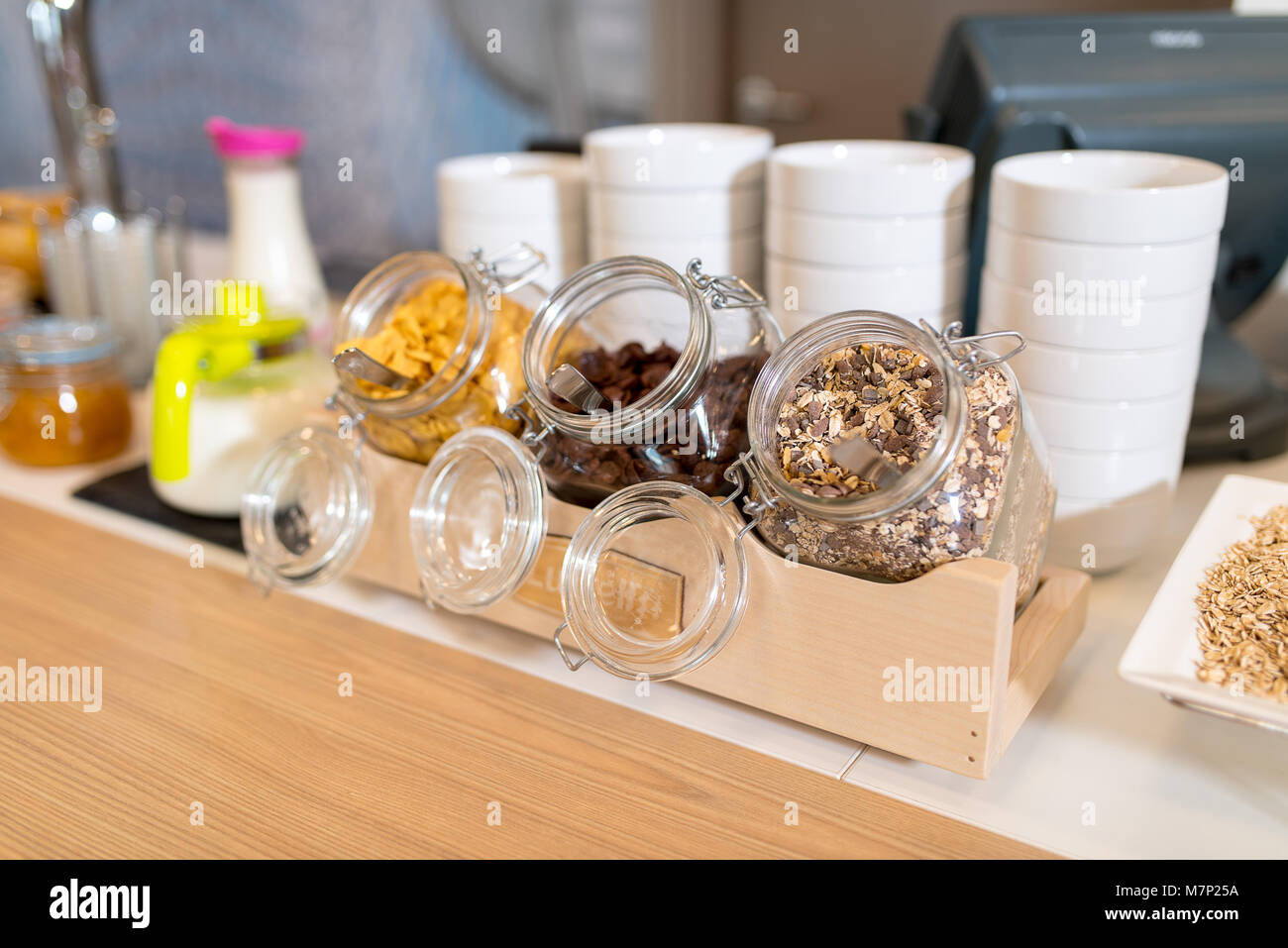 Hotel buffet with museli in glass jar, raisins and corn flakes Stock ...
