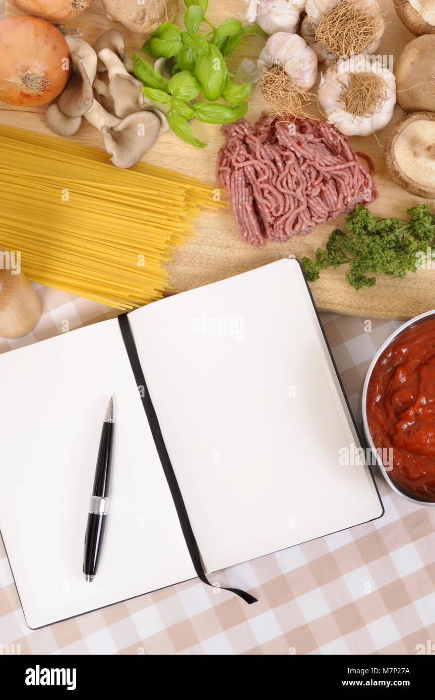 Making Italian spaghetti bolognese with ingredients and blank recipe ...