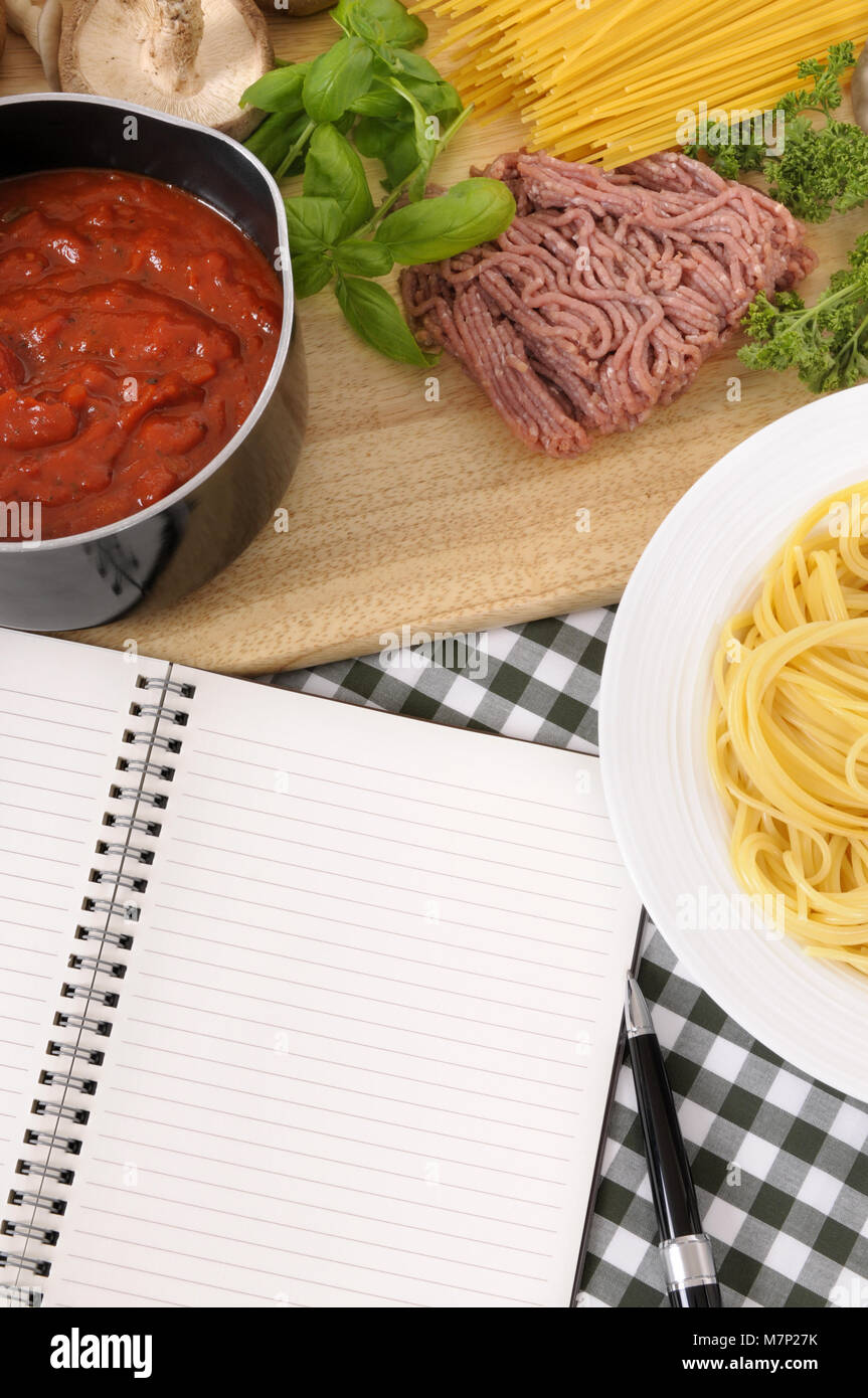 Making Italian spaghetti bolognese with ingredients and blank recipe ...
