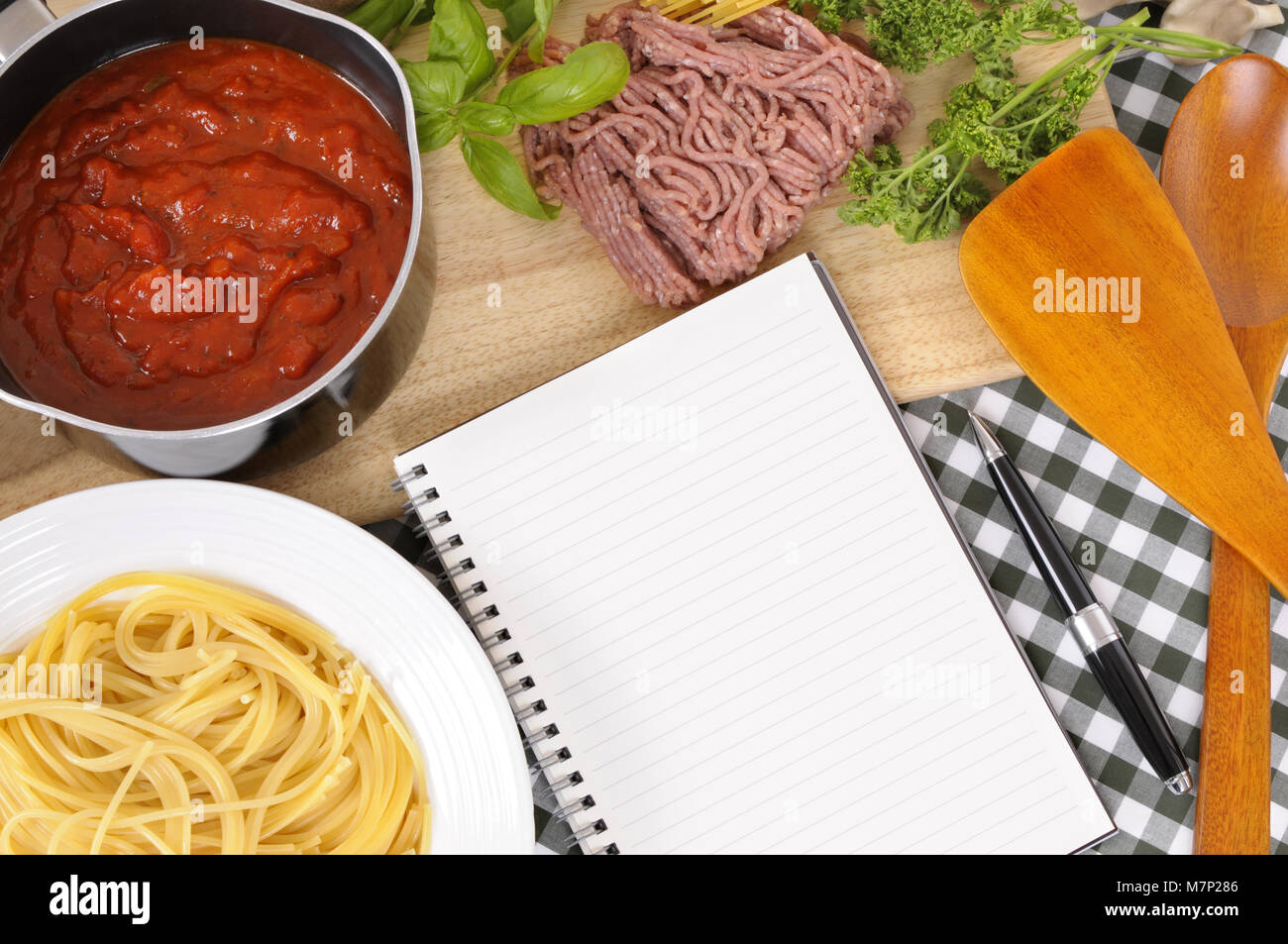 Making Italian spaghetti bolognese with ingredients and blank recipe ...