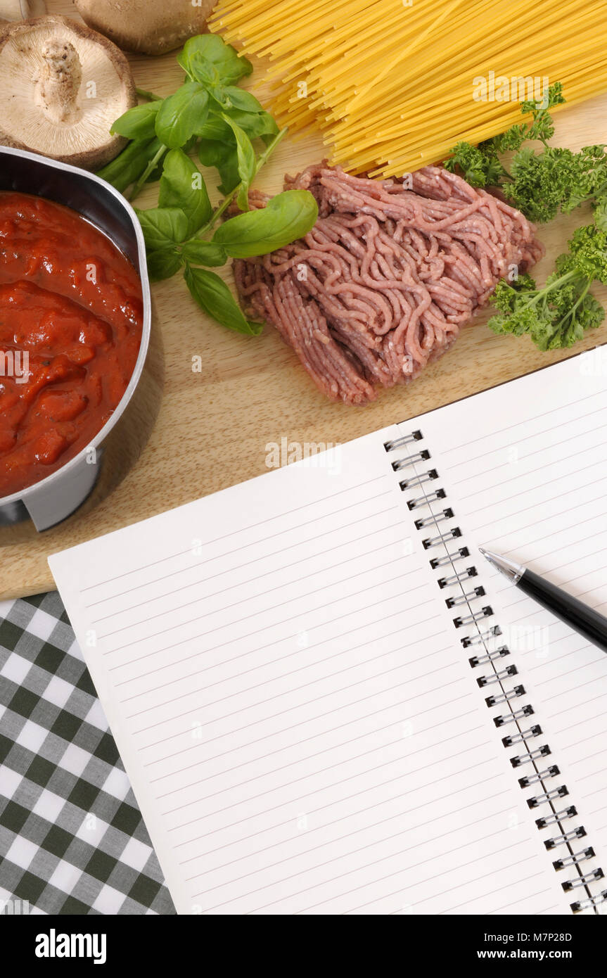 Making Italian spaghetti bolognese with ingredients and blank recipe ...