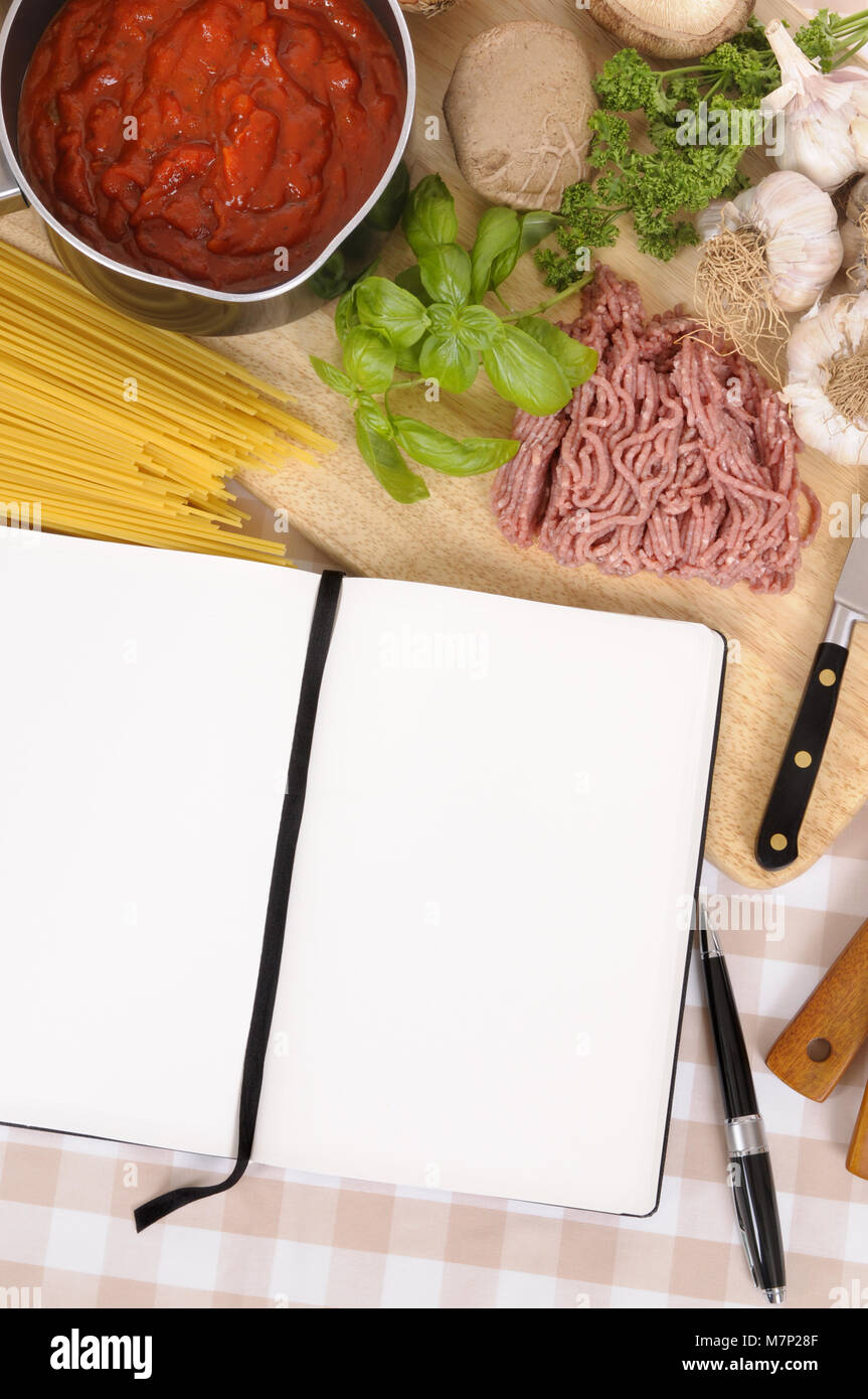 Making Italian spaghetti bolognese with ingredients and blank recipe ...