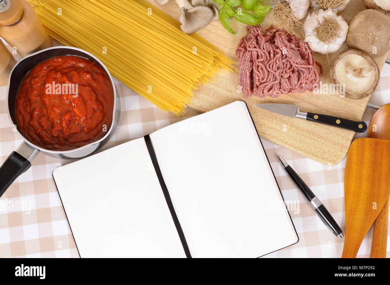 Making Italian spaghetti bolognese with ingredients and blank recipe ...