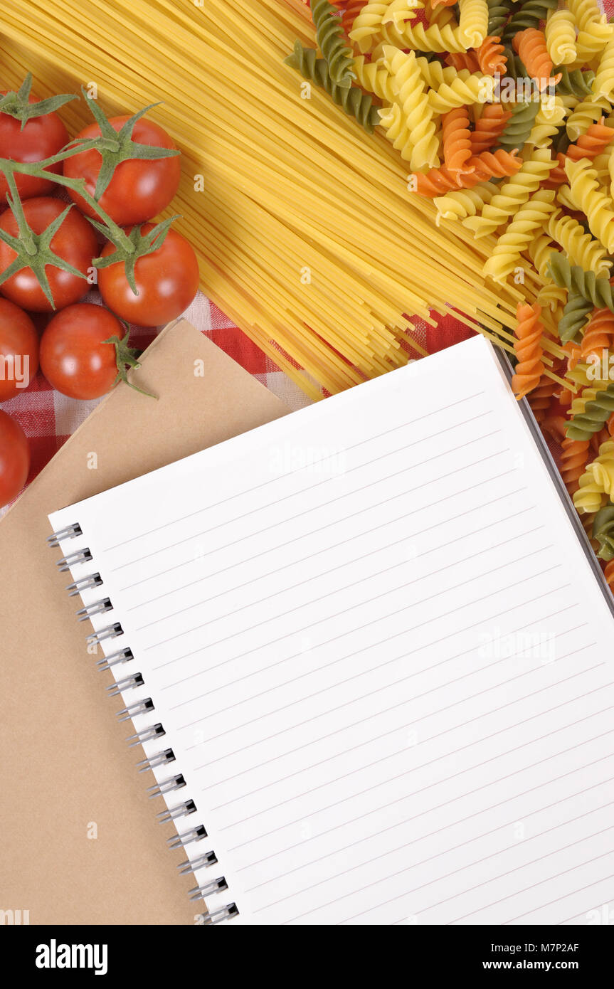 Selection of Italian spaghetti and pasta with blank recipe book or ...