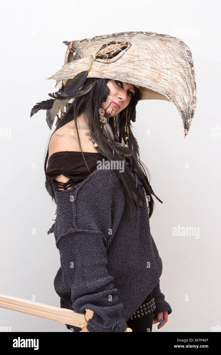 Beautiful girl dressed in witch or shaman halloween costume with black ...