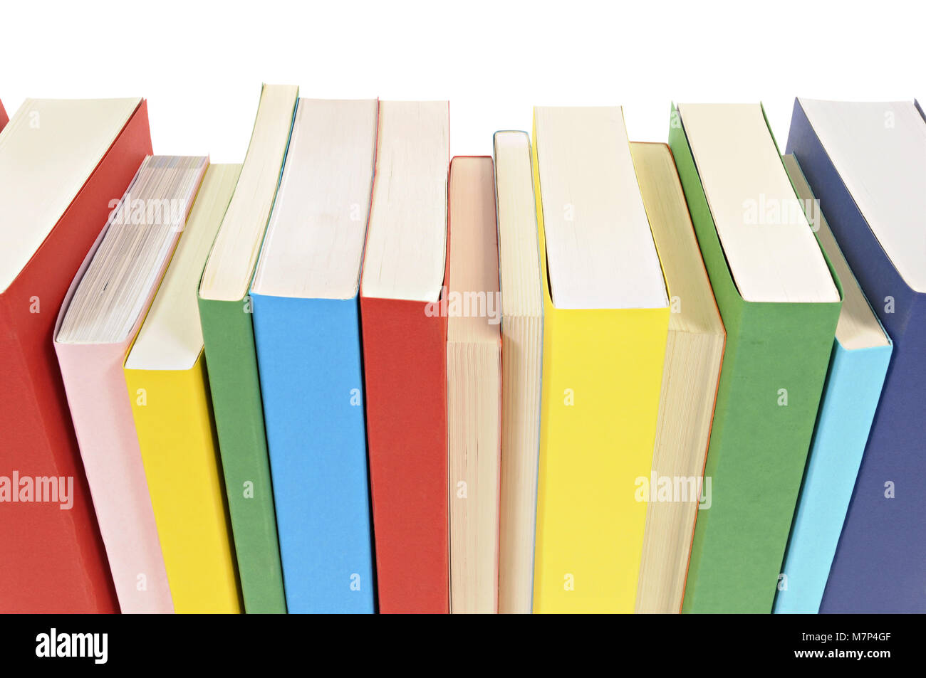 Row of colorful paperback books isolated on a white background Stock ...