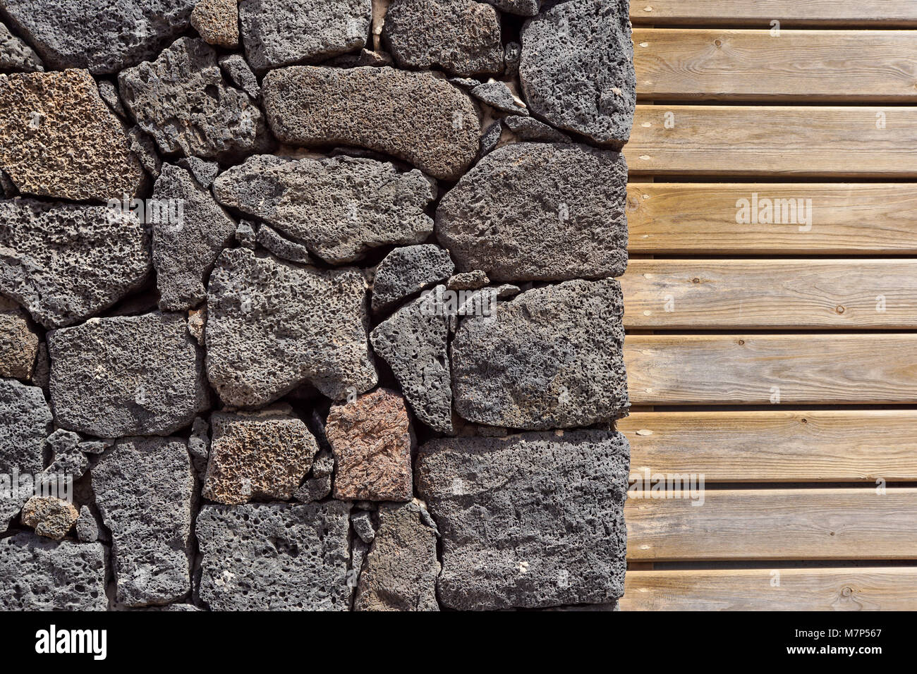 Stone wall background. stone and wood wall, wood texture as background ...