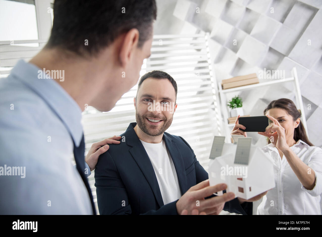 Alert architects taking photos in the office Stock Photo - Alamy