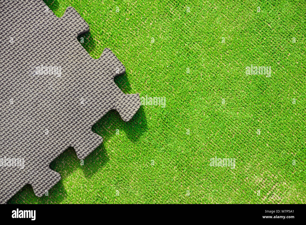 Jigsaw puzzle pieces on bright green background, horizontal view Stock ...