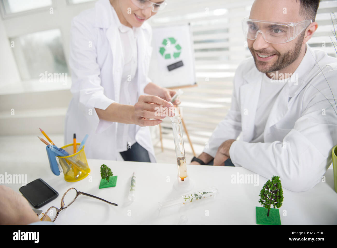 Inspired scientist doing important tests Stock Photo - Alamy