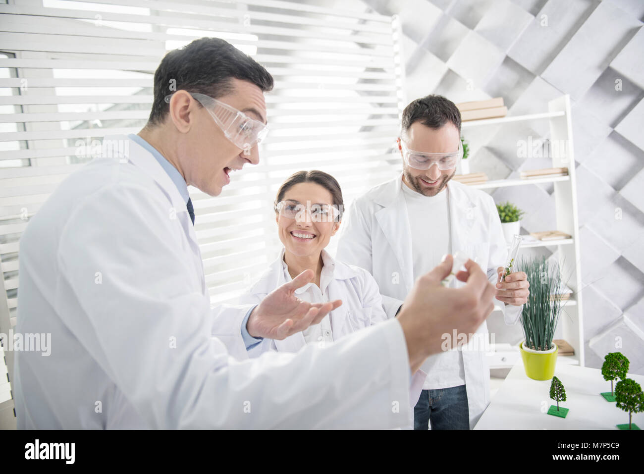 Smiling scientist delighted with test results Stock Photo - Alamy