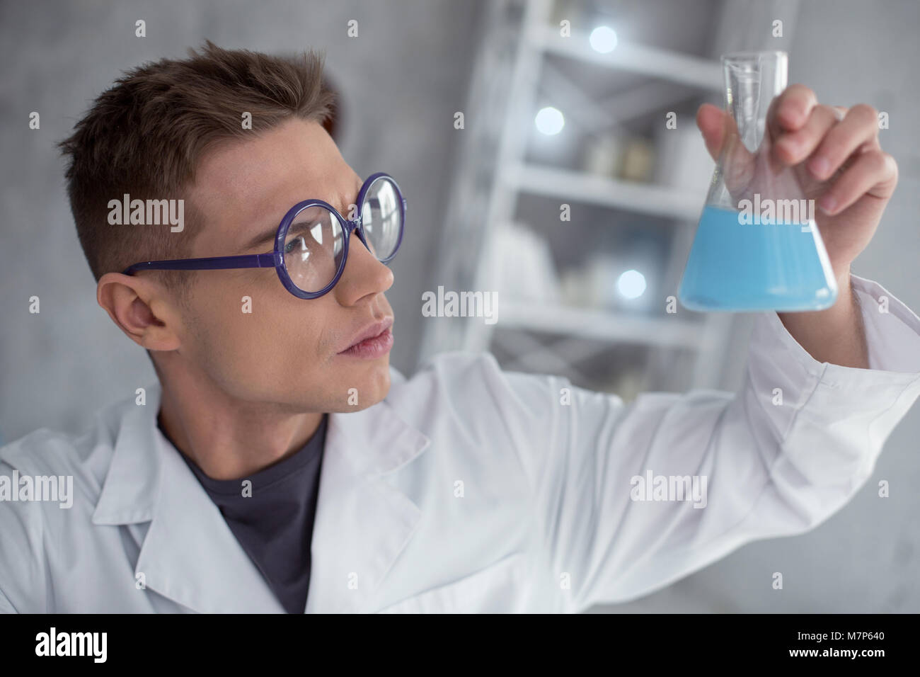 Determined teenager doing an interesting experiment Stock Photo - Alamy