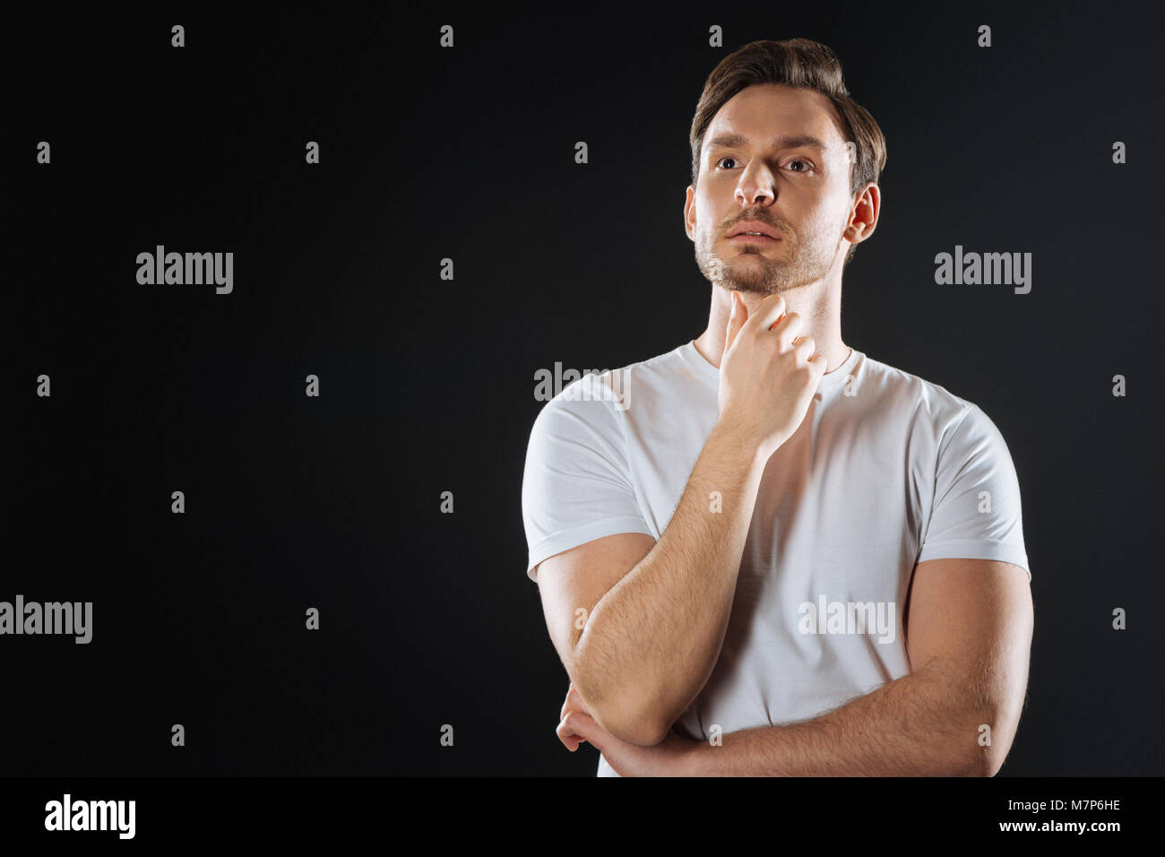 Deep clever man standing and thinking Stock Photo - Alamy