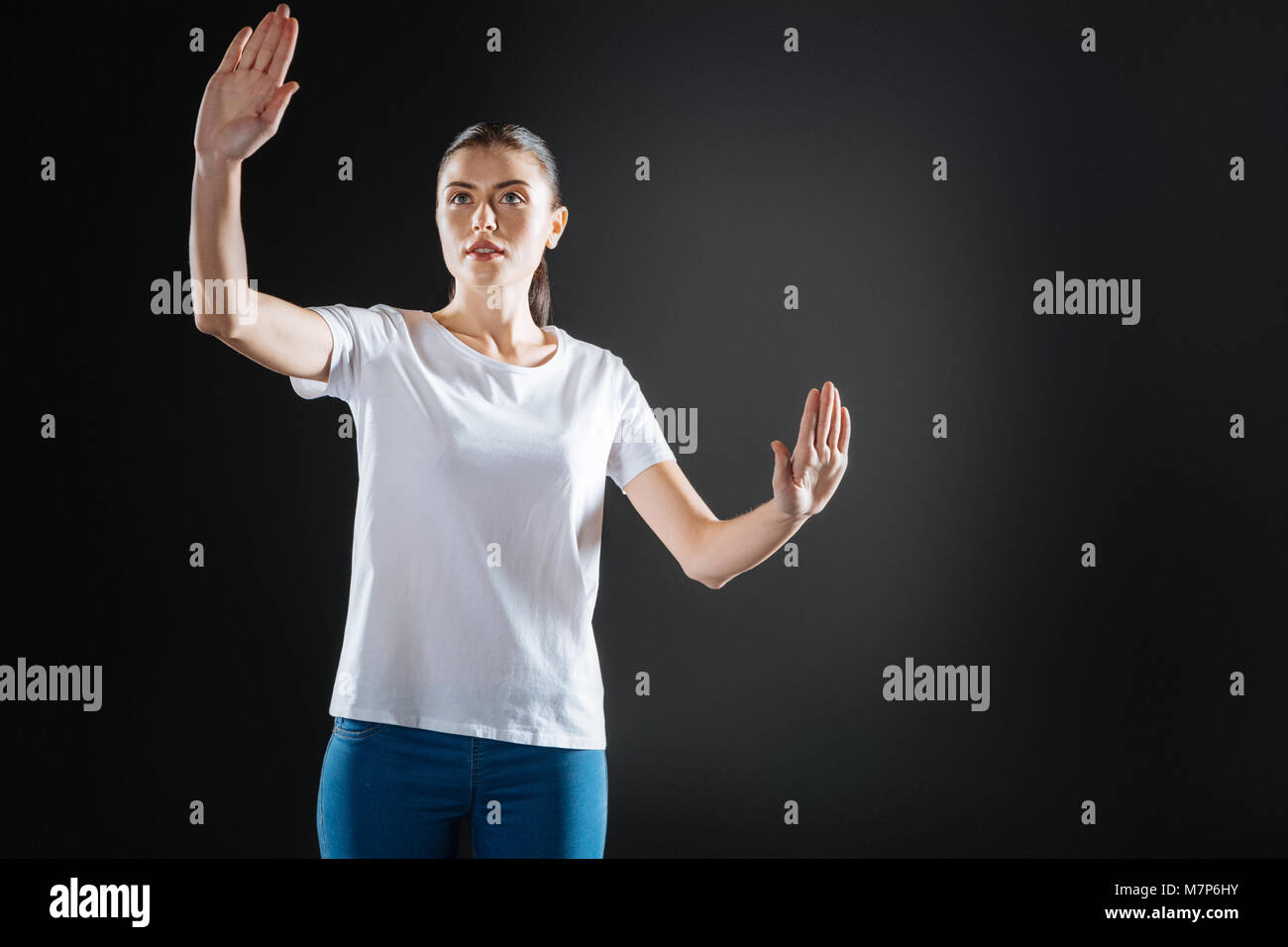 Creative pretty woman standing and shaking hands Stock Photo - Alamy