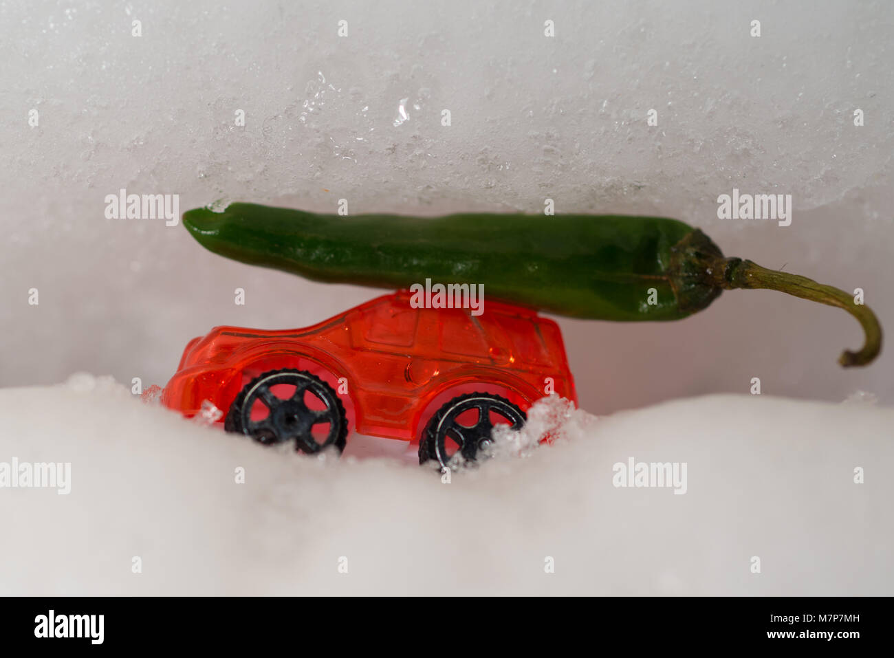transparent coloured toy cars stuck in ice and snow Stock Photo - Alamy