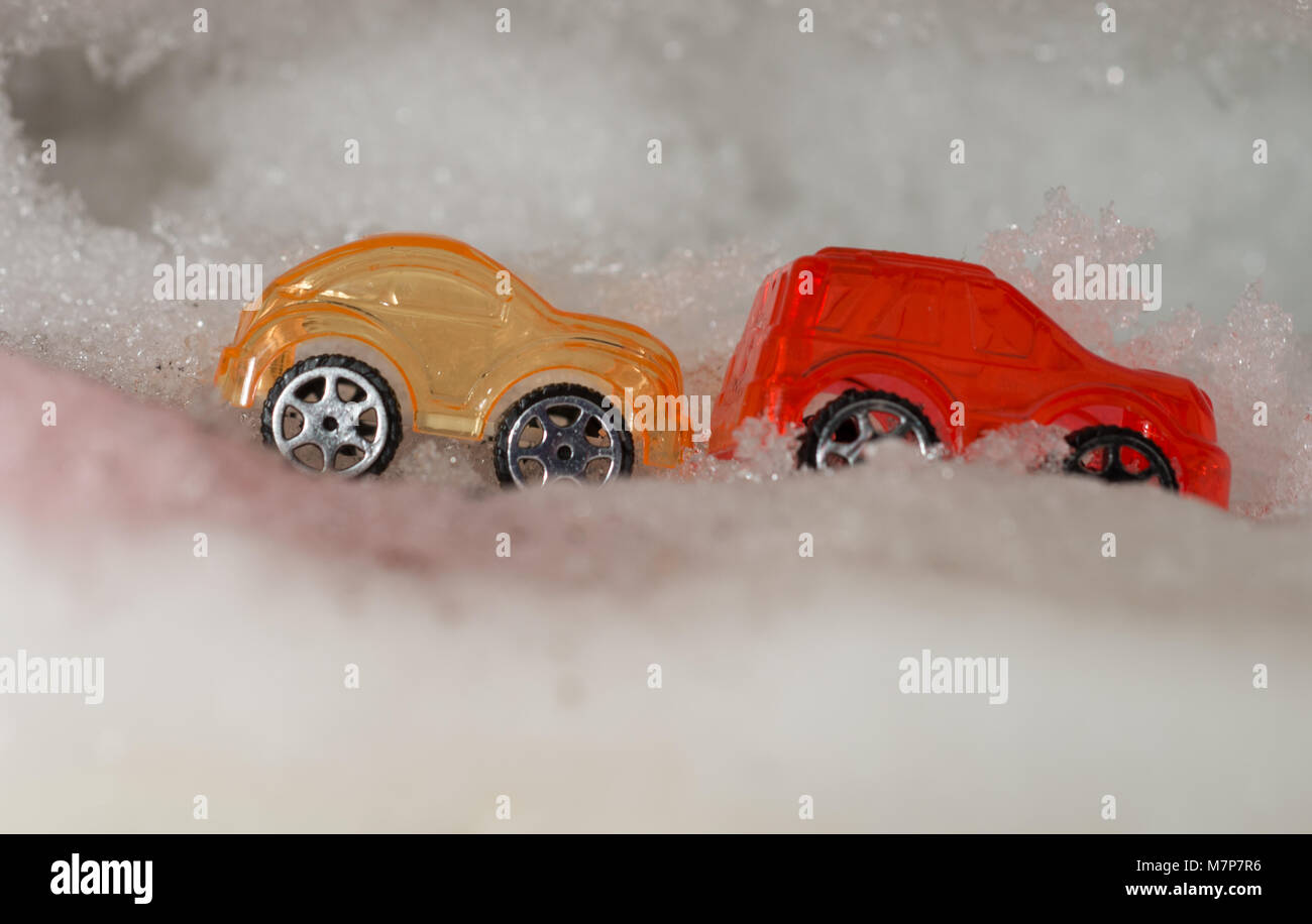 transparent coloured toy cars stuck in ice and snow Stock Photo - Alamy