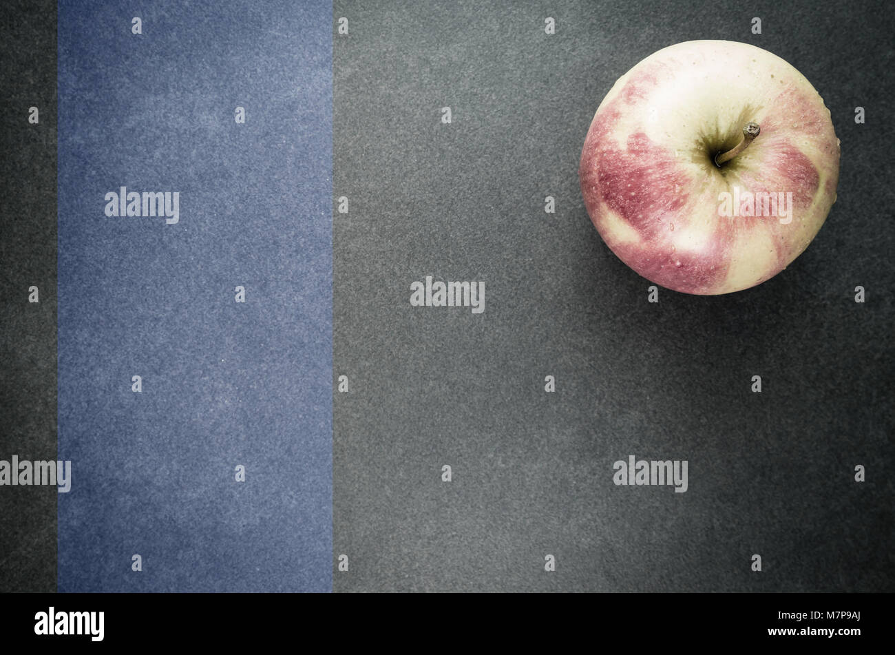 fresh organic apple on a dark stone surface - directly above view Stock ...