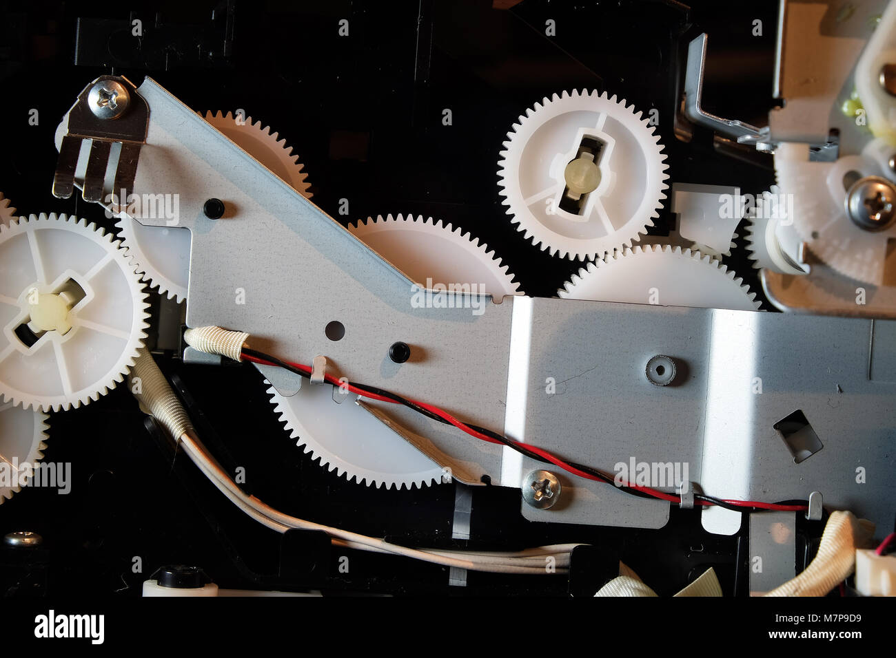 Close image of drive gears and cogs in a computer printer for extreme ...