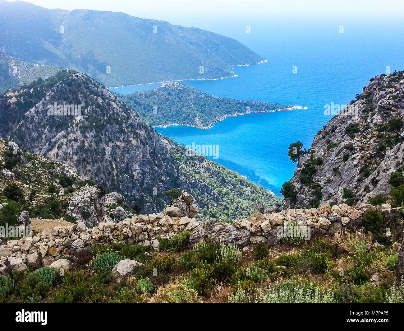 view from the top of the lycian way on rocks, beaches and blue water in ...