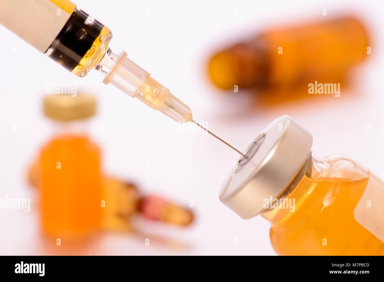 medical injection and vaccination with syringe and serum Stock Photo ...