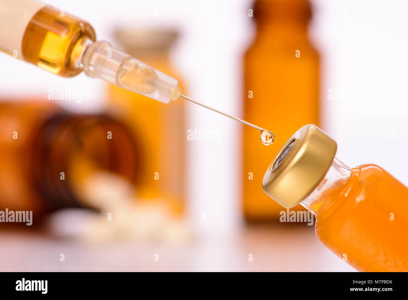 medical injection and vaccination with syringe and serum Stock Photo ...