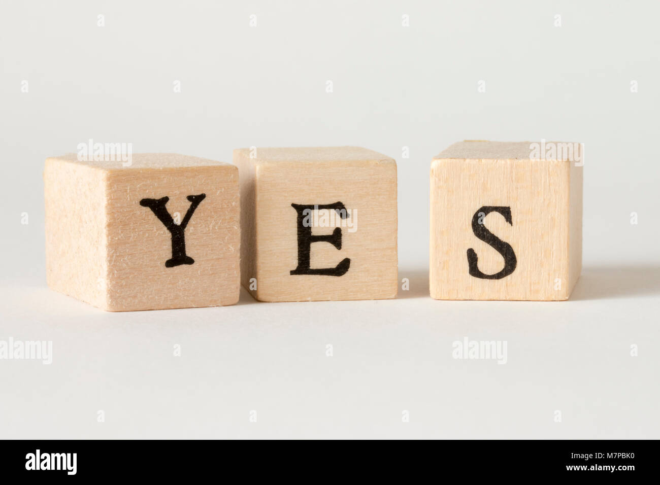 YES word made with building blocks - Sign of acceptance Stock Photo - Alamy